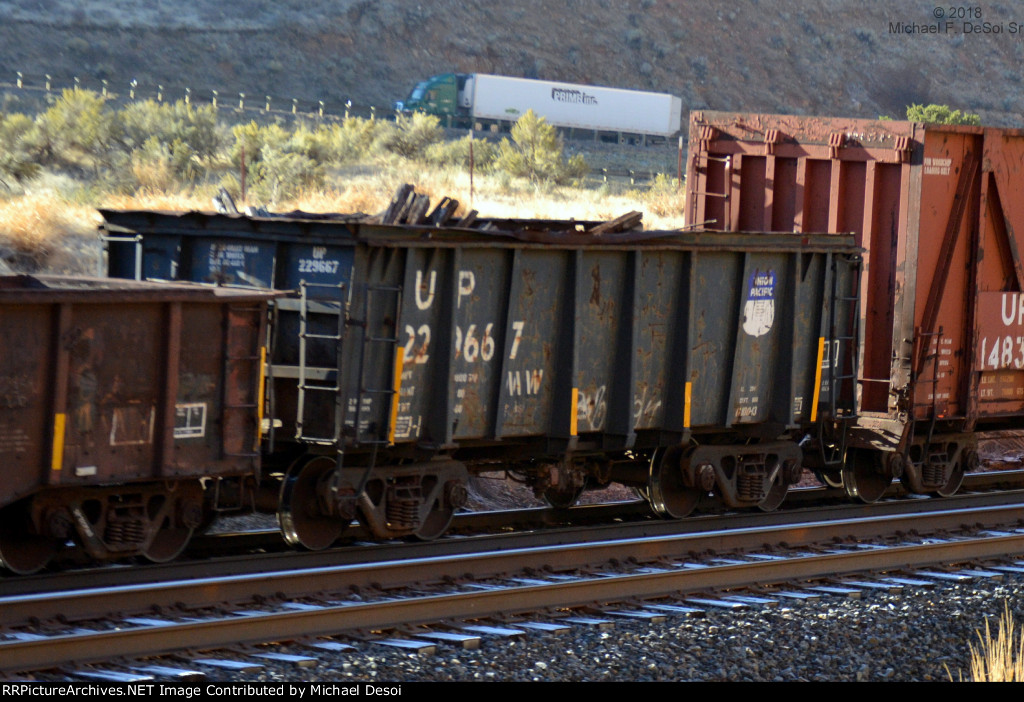 UP ore jennie (#229667) now in M of W service in a westbound UP freight train in Echo Canyol, UT ...